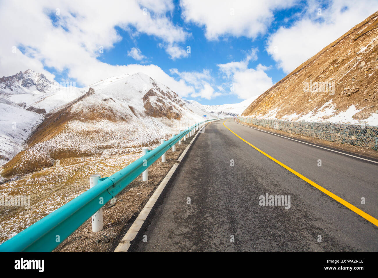 Snow mountain highway landscape Stock Photo - Alamy