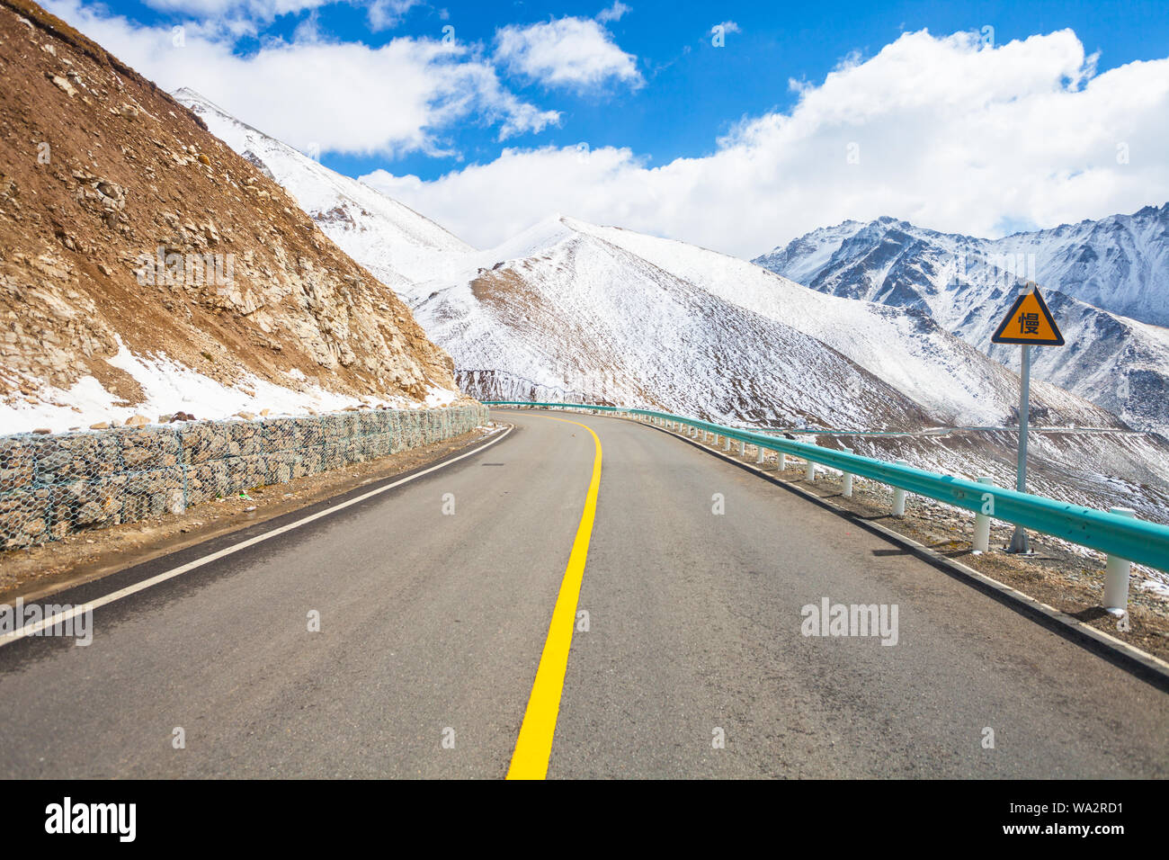 Snow mountain highway landscape Stock Photo - Alamy