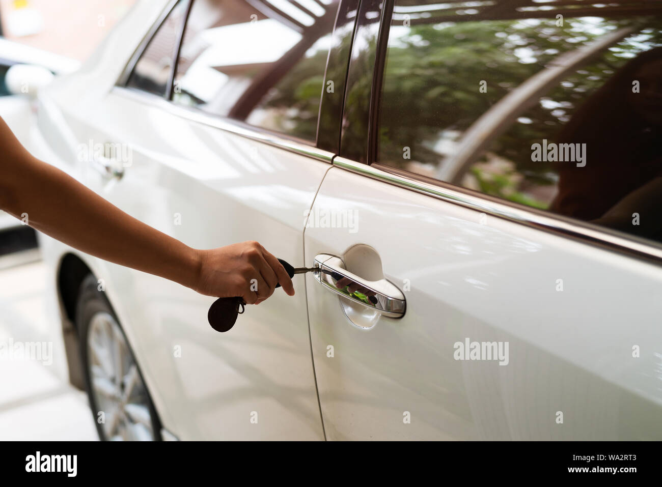 Woman man keys agent door hi-res stock photography and images - Alamy
