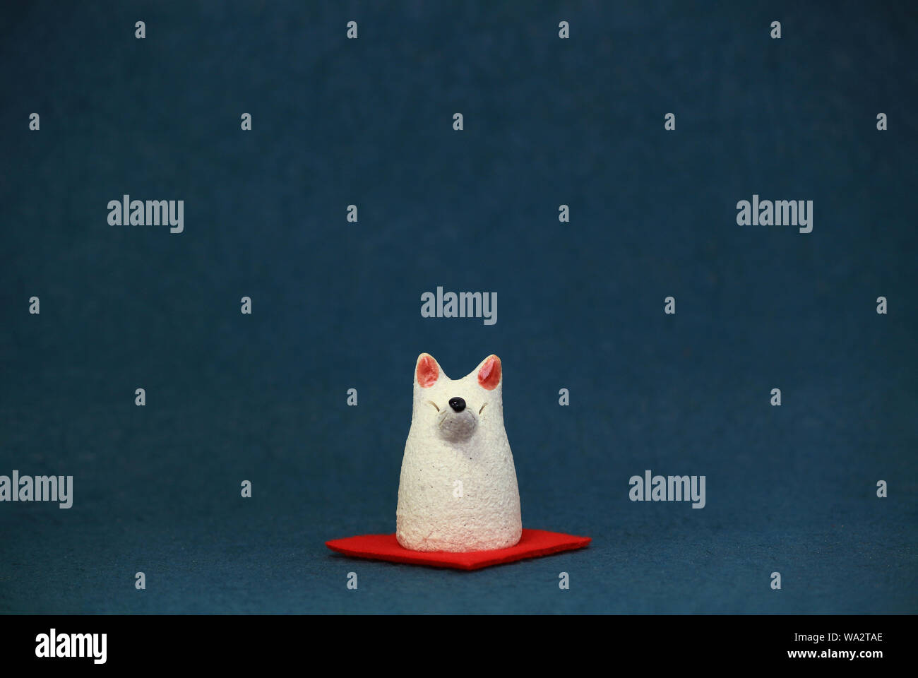 Still life photo of Japanese white fox figurine Stock Photo - Alamy