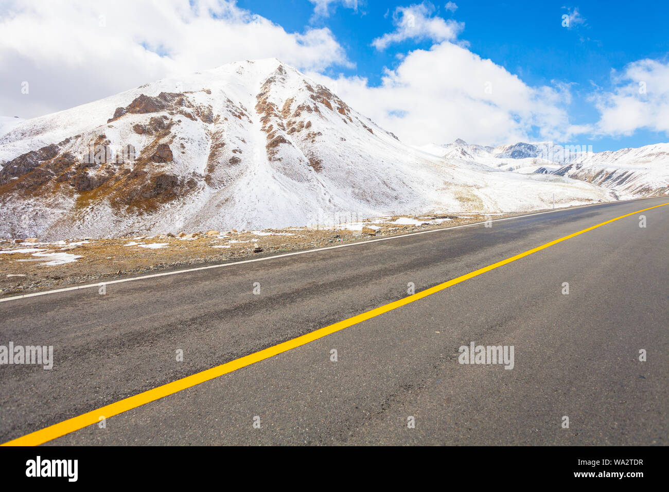 Snow mountain highway landscape Stock Photo - Alamy