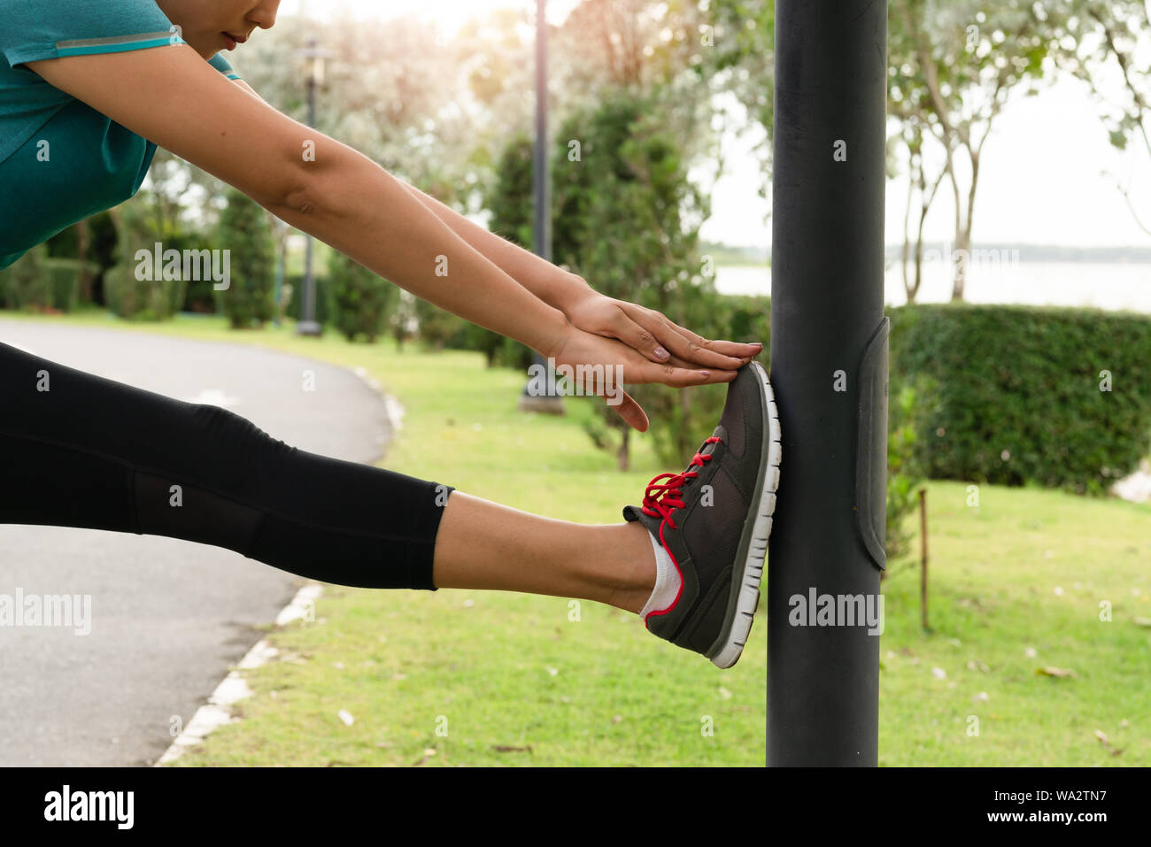 sport woman is stretching muscle before workout Stock Photo - Alamy