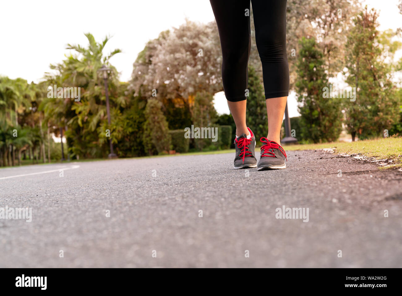 sport woman walking towards on the road side. Step concept Stock Photo ...