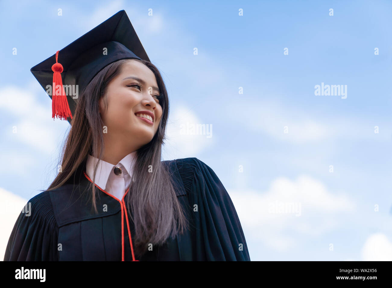 Portrait closeup. Asian beautiful smiley graduate graduated student ...