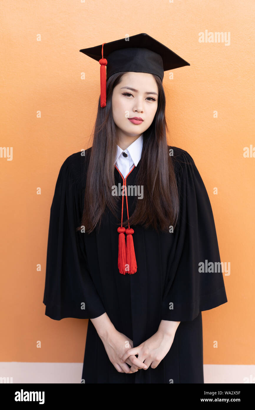 Portrait closeup. Asian beautiful smiley graduate graduated student ...