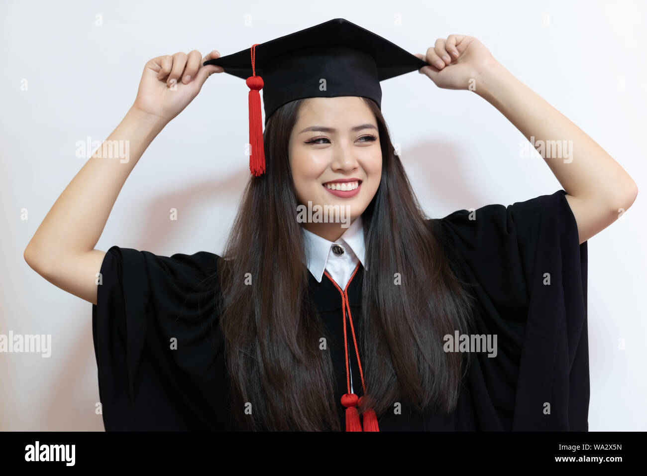 Portrait closeup. Asian beautiful smiley graduate graduated student ...
