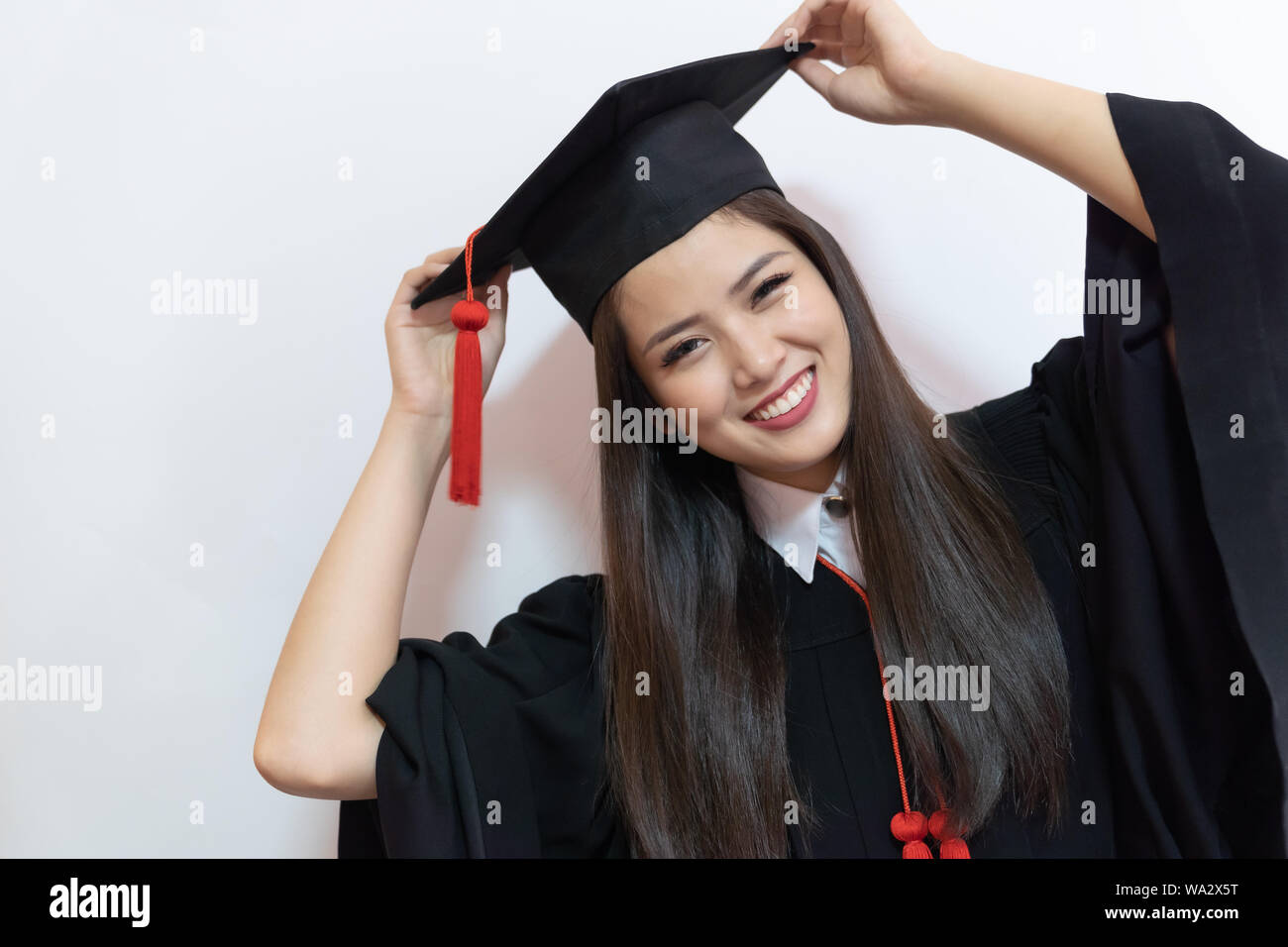Portrait closeup. Asian beautiful smiley graduate graduated student ...