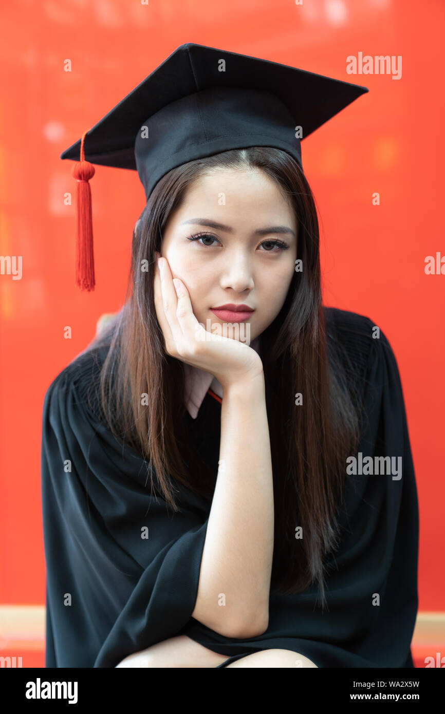 Portrait closeup. Asian beautiful smiley graduate graduated student ...