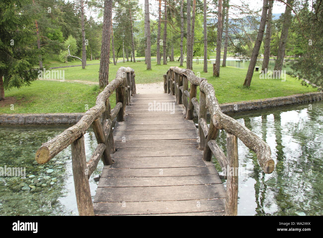 Old crooked wooden bridge hi-res stock photography and images - Alamy