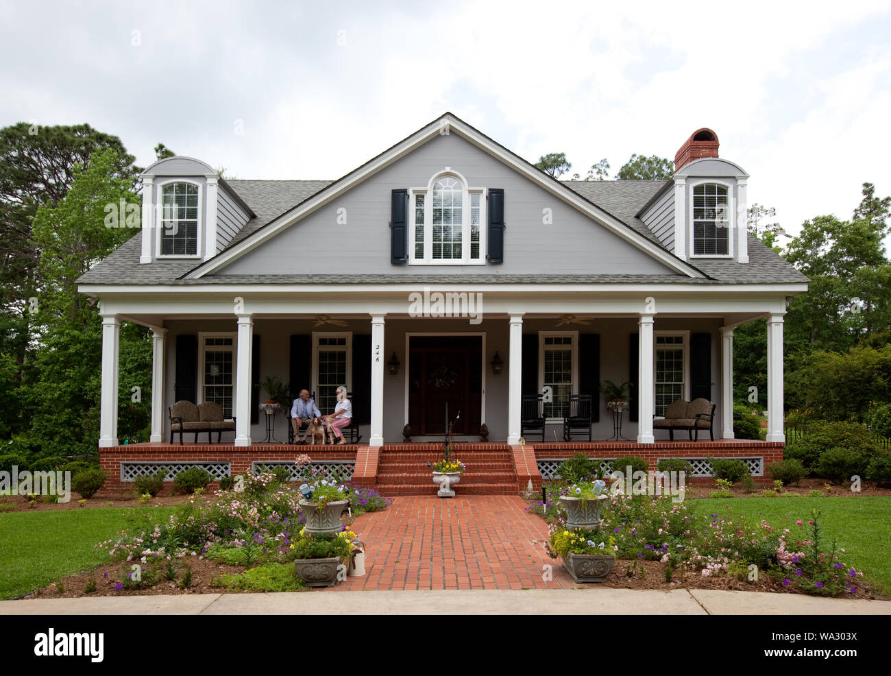 Billy Carson Bond and his wife Evelyn sitting on the porch with their ...