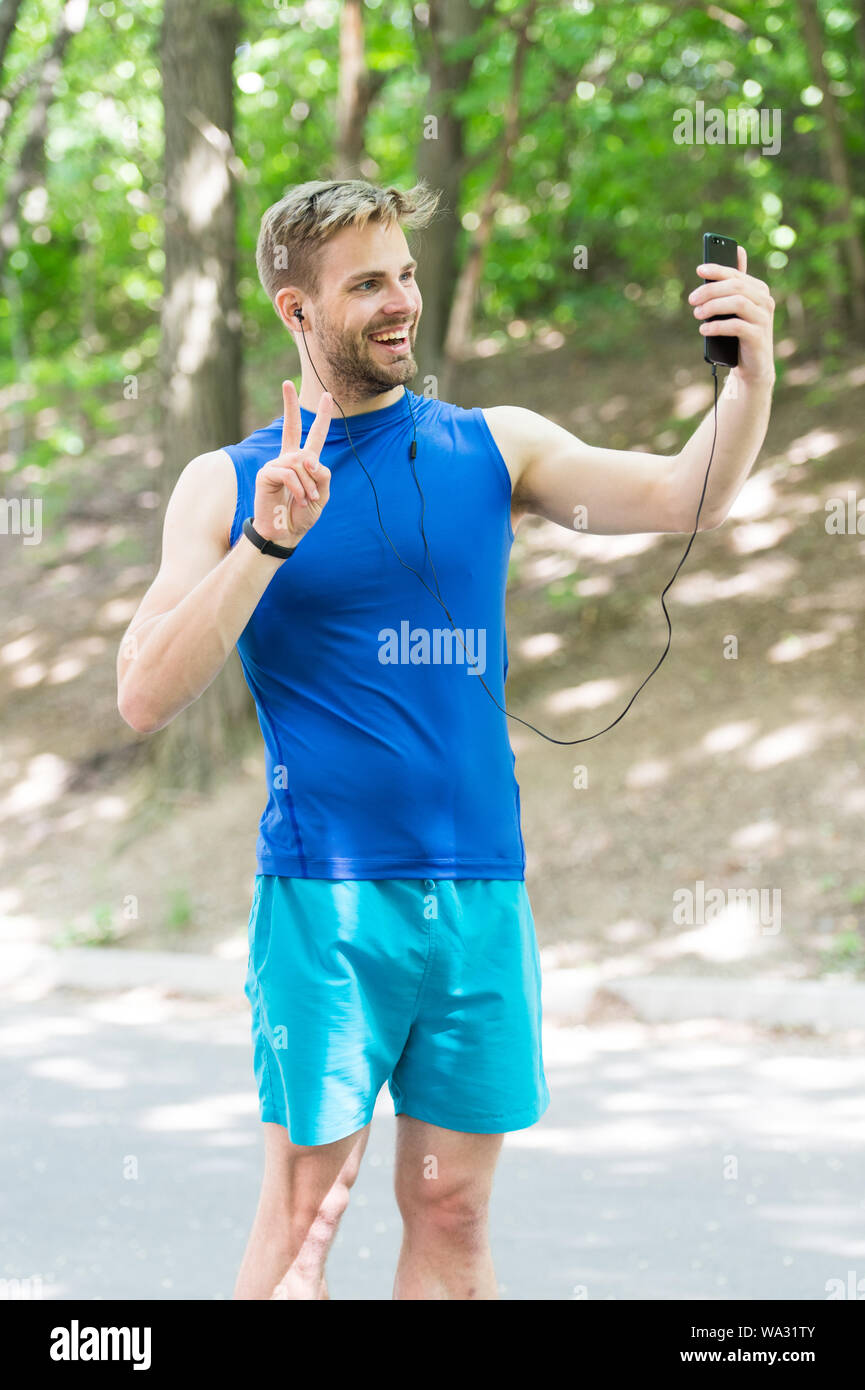 healthy life. athletic man in sportswear make selfie. outdoor workout ...