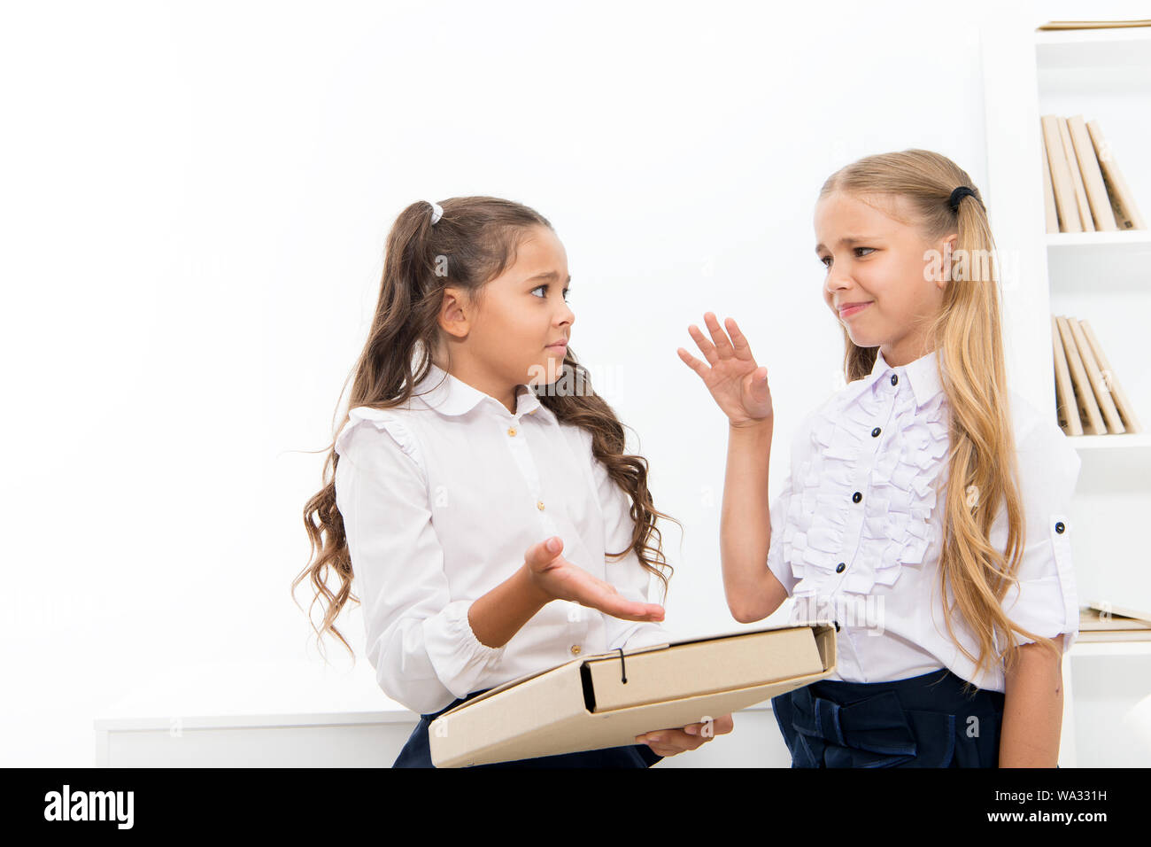 Discussing homework. Help with project. Schoolgirls study together ...