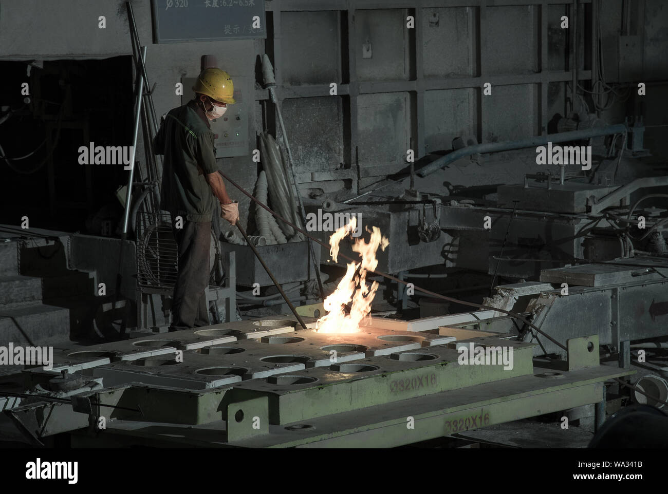 Metal industry workers operating hi-res stock photography and images ...