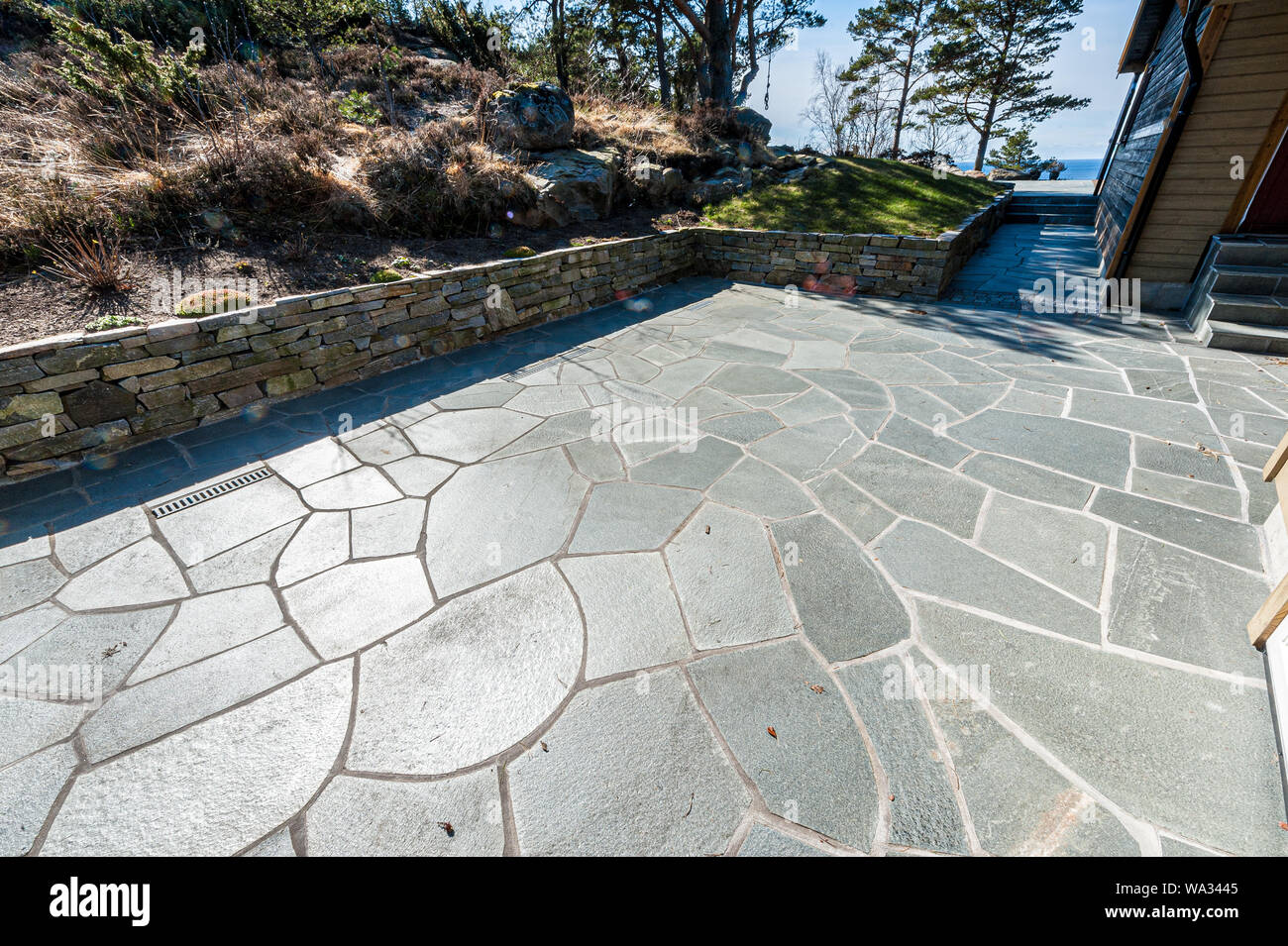 Driveway with slate stone slabs Stock Photo - Alamy