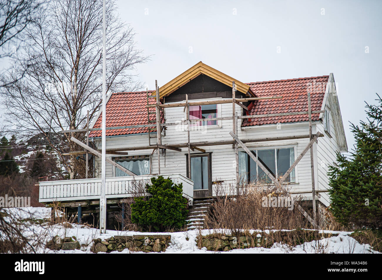 Old, white wooden house being renovated Stock Photo - Alamy