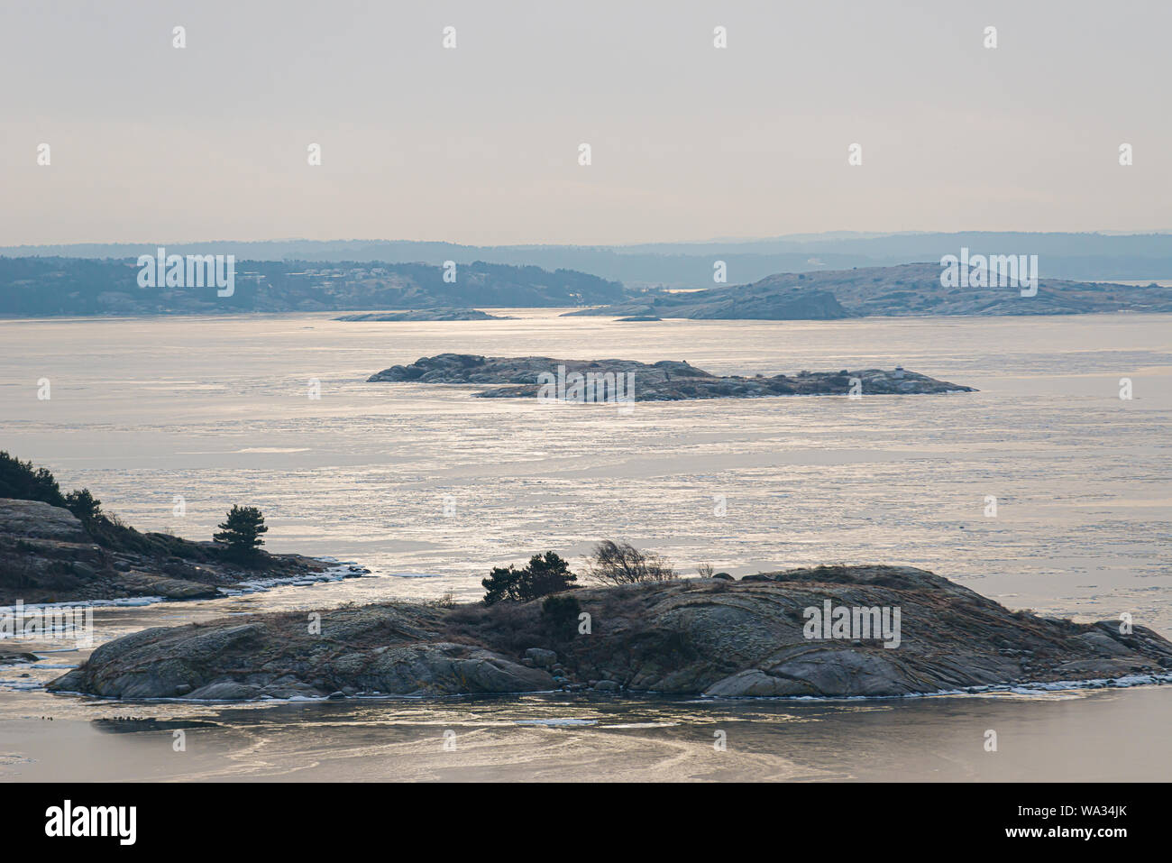 View over small islands in an icy fjord Stock Photo - Alamy