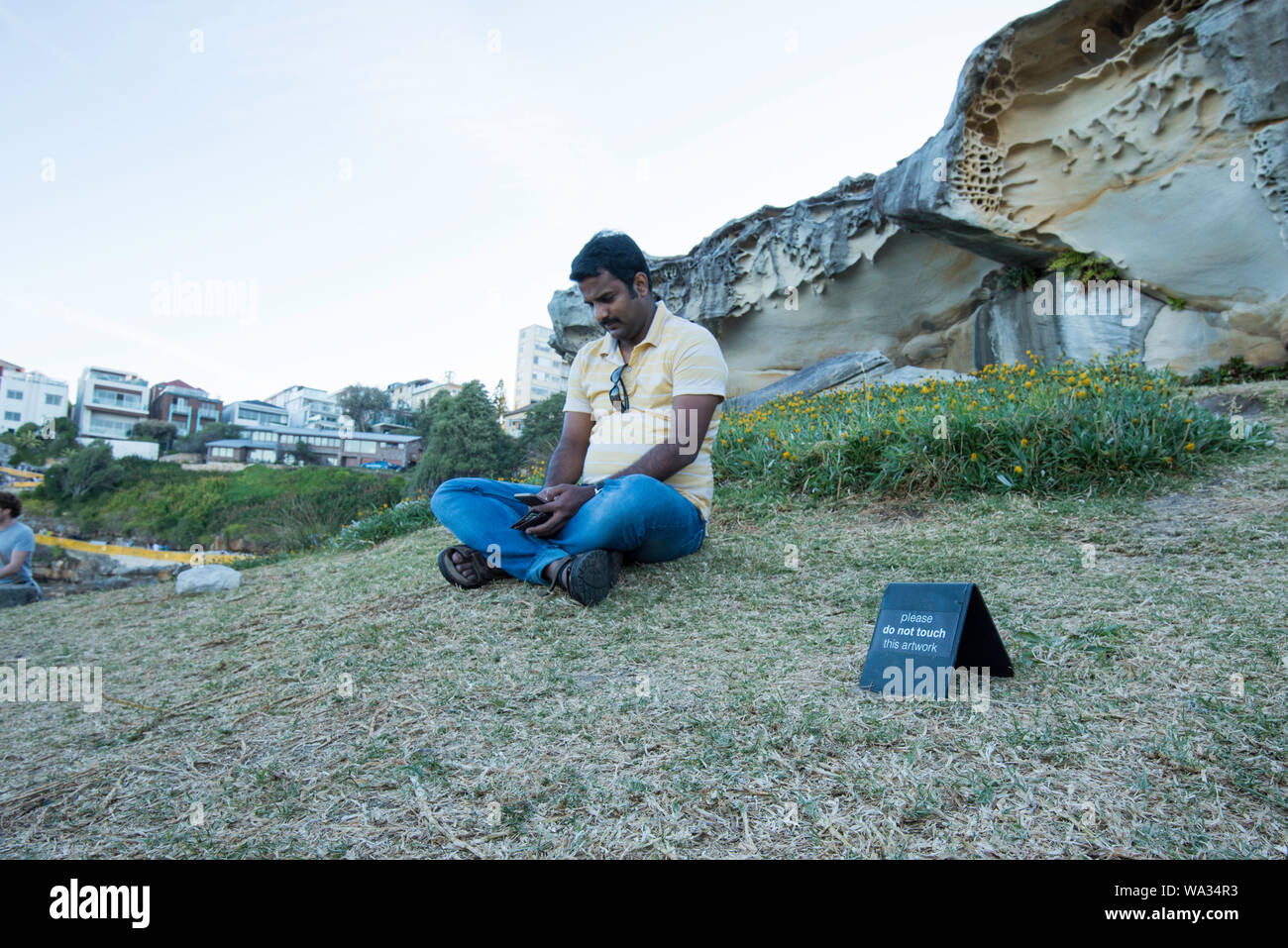 A person unwittingly becomes the exhibit at 20th Sculpture by the Sea ...