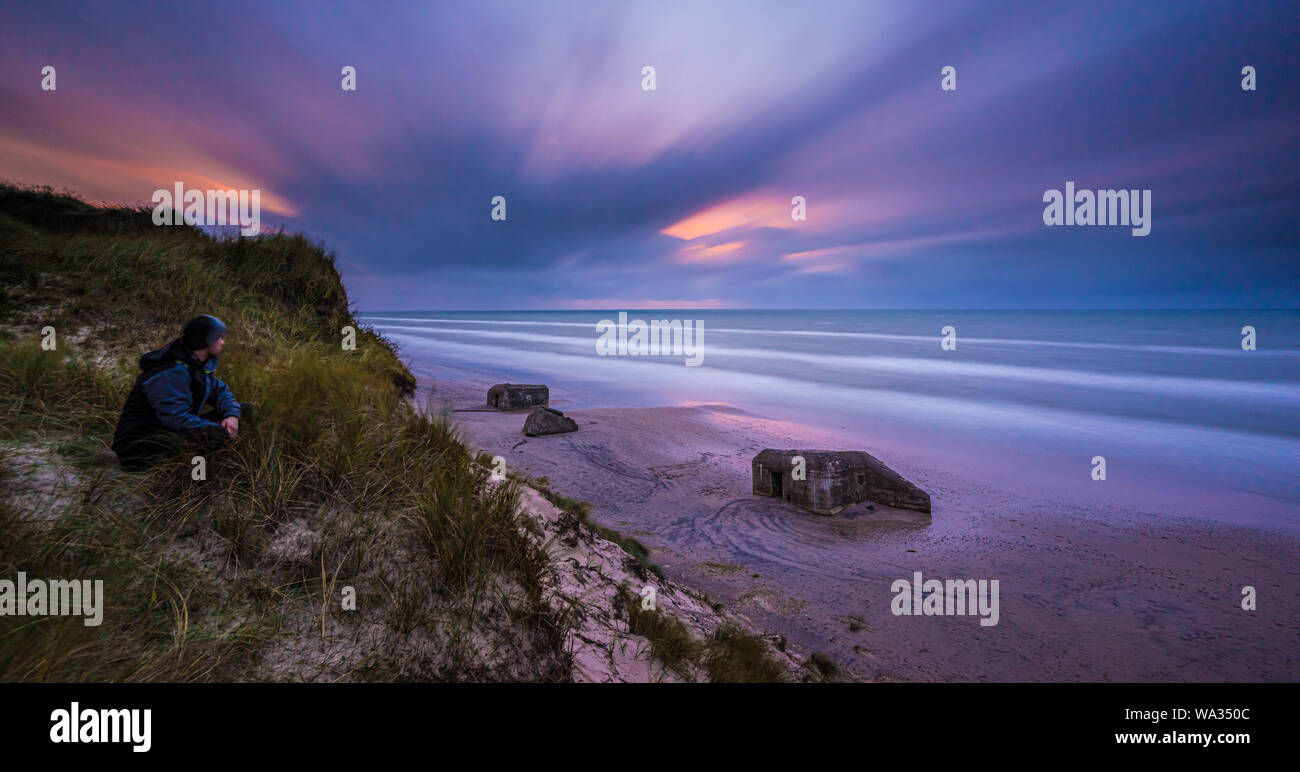 Long exposure of old bunker fortifications on a sandy beach Stock Photo ...