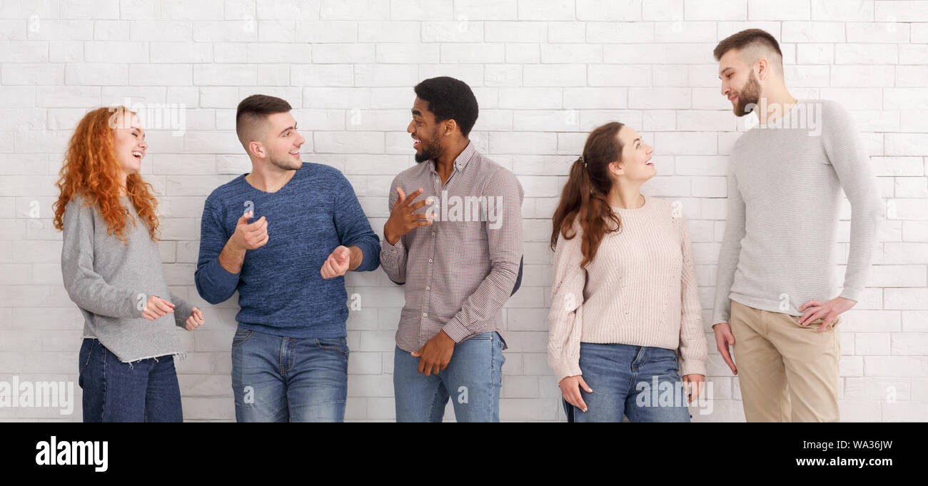Friendly students talking, having break at college Stock Photo - Alamy