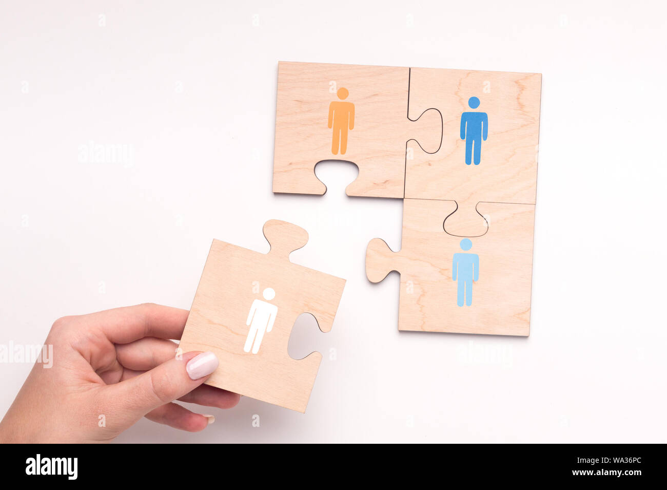Woman creating puzzle with people who helping together Stock Photo - Alamy Woman creating puzzle with people who helping together Stock Photo - Alamy