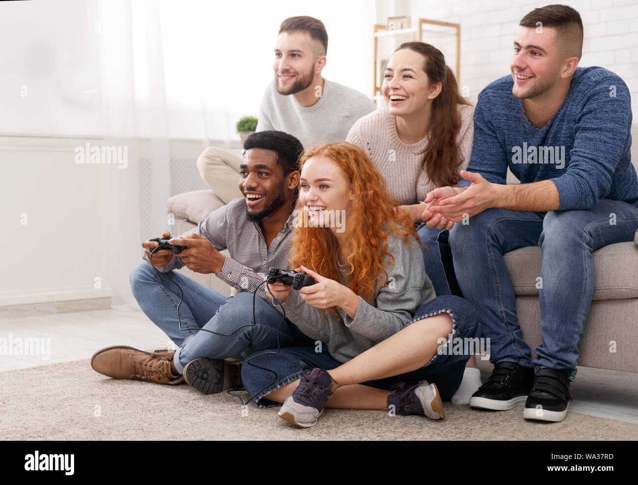 Friends together living room hi-res stock photography and images - Alamy