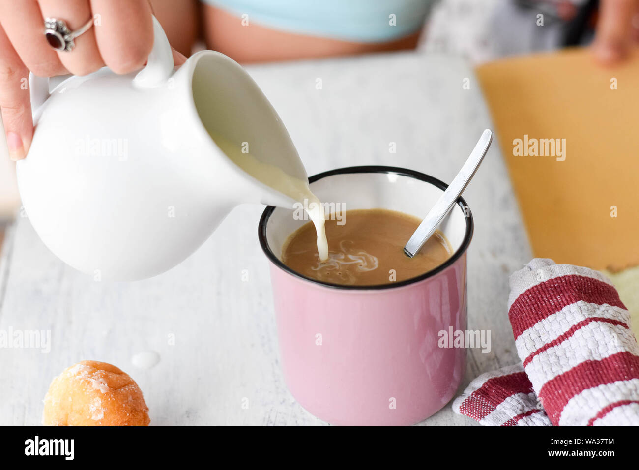 Table pouring milk hi-res stock photography and images - Alamy