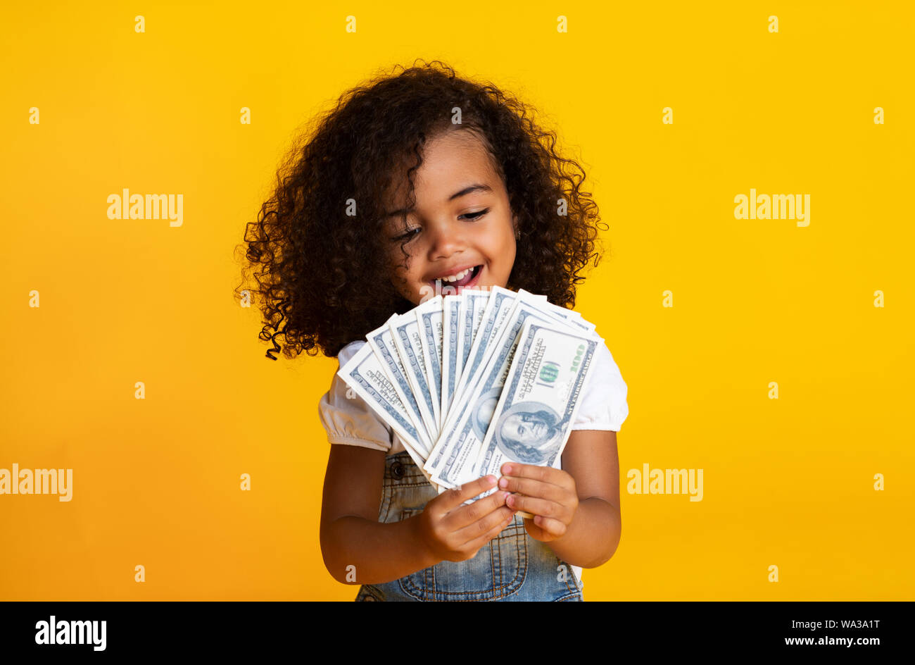 Kid holding money hi-res stock photography and images - Alamy