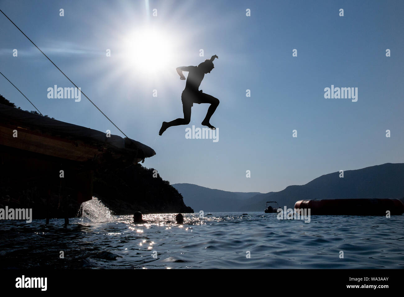 A boy jumps into the Mediterranean sea near Kalkan in Turkeu Stock ...