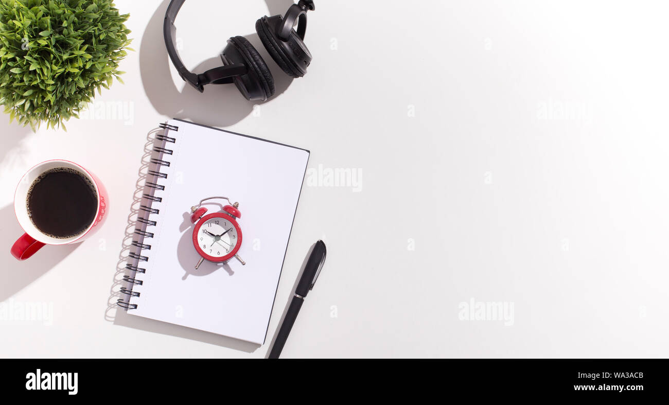 Modern workplace with alarm clock and cup of morning coffee Stock Photo ...