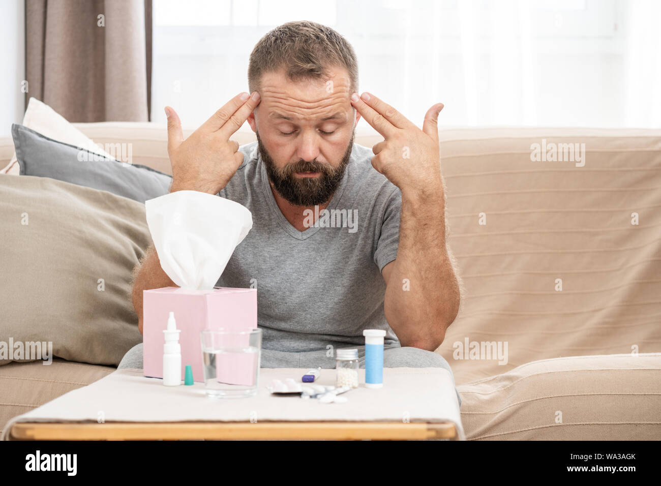 High temperature concept. Man feels badly ill. How to bring fever down ...