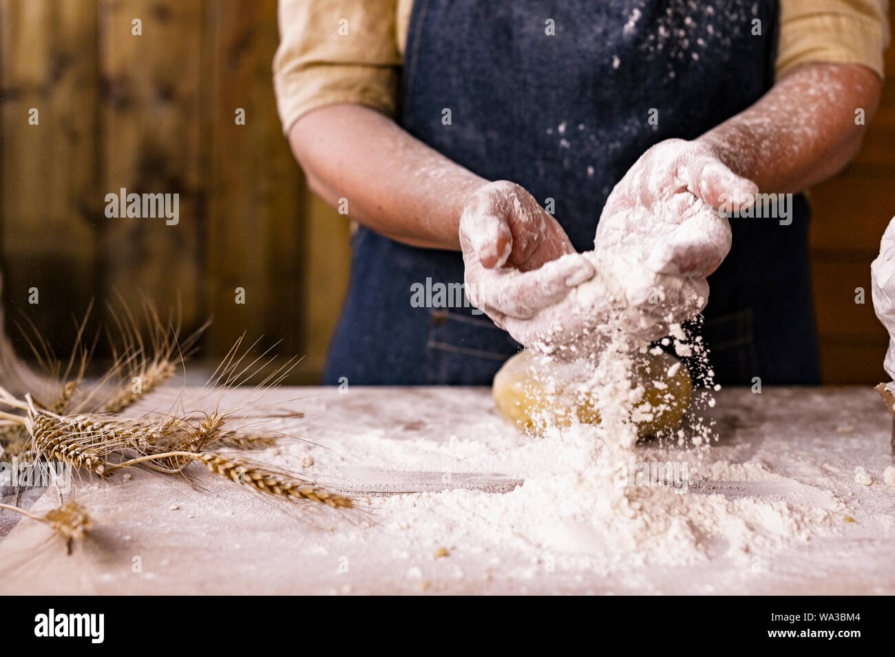 Women's hands, flour and dough. Levitation in a frame of dough and ...