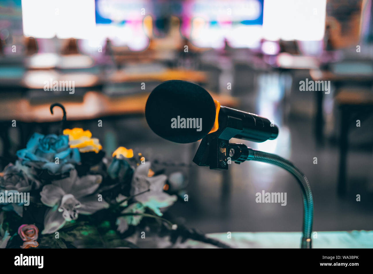 microphone in modern conference hall interior with white chairs ...
