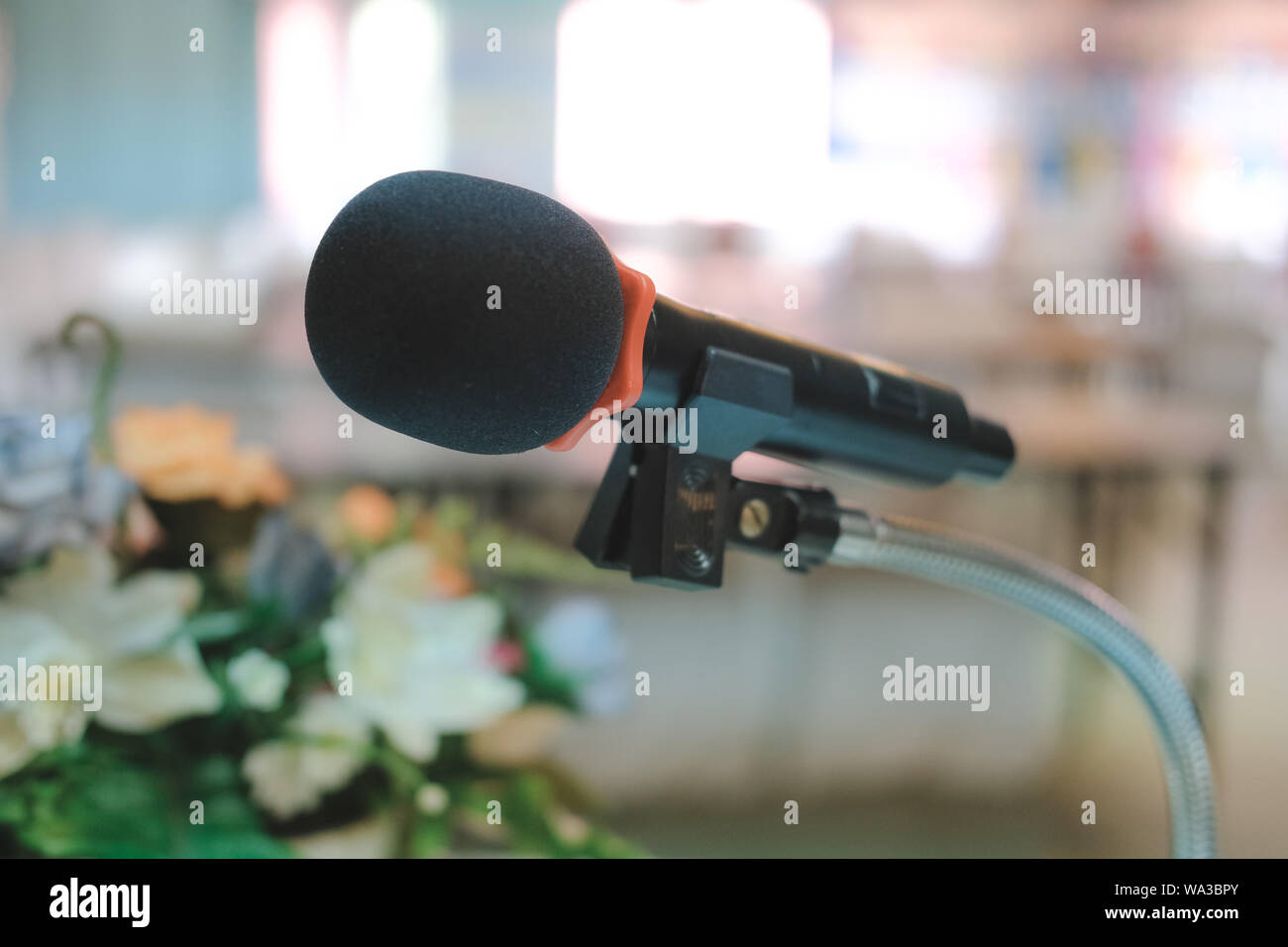 microphone in modern conference hall interior with white chairs ...