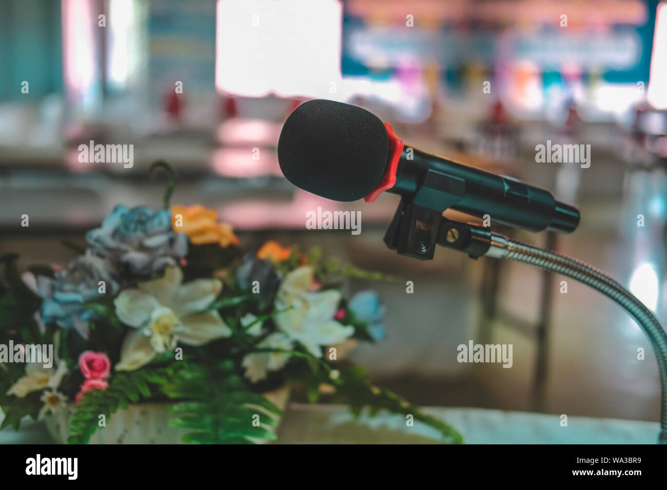 microphone in modern conference hall interior with white chairs ...