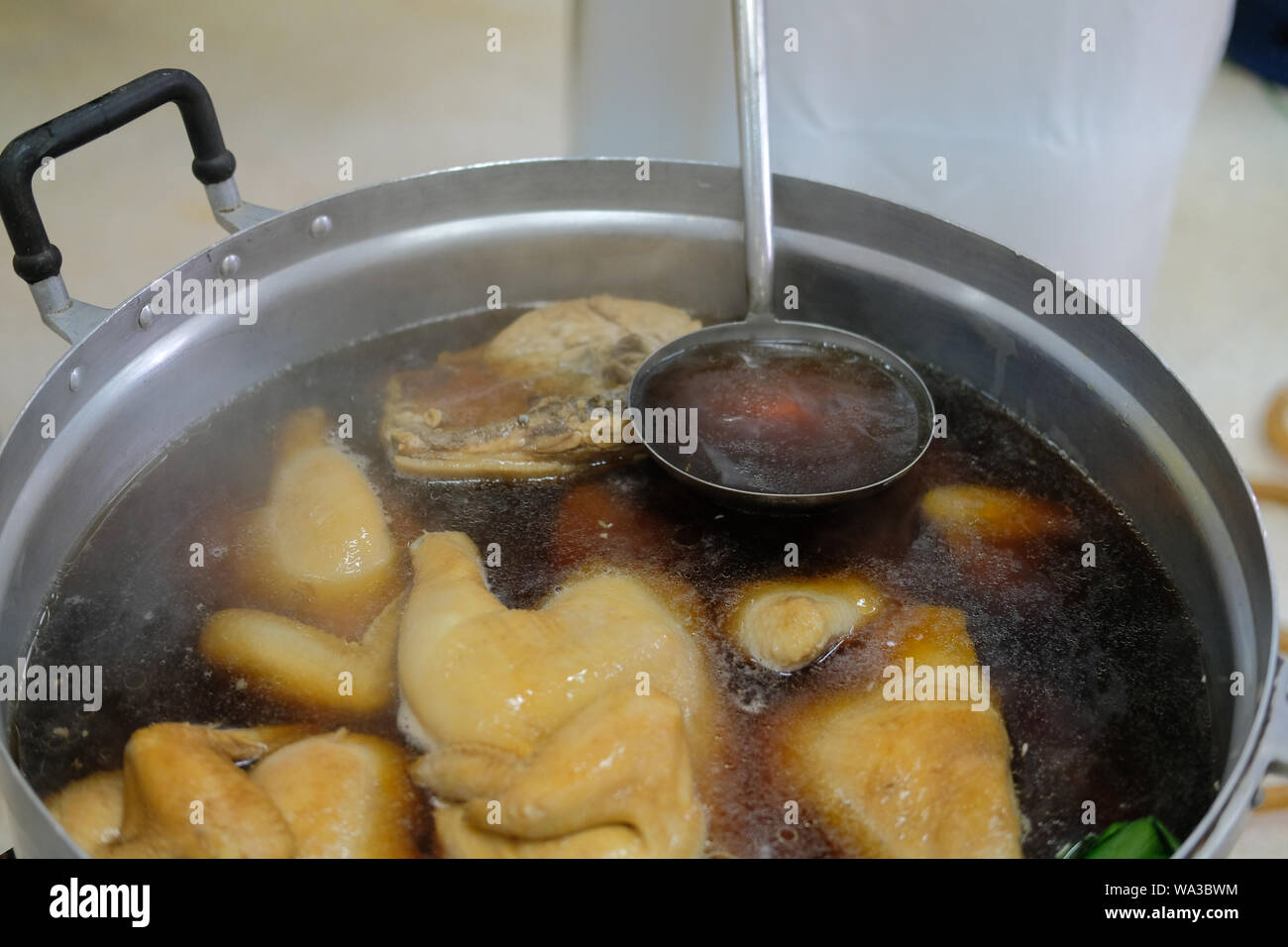 chicken boiling in fish sauce soup. boiled braised chicken Stock Photo ...