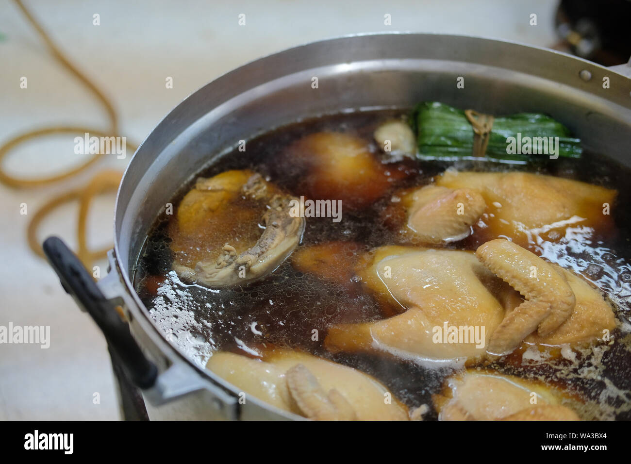 chicken boiling in fish sauce soup. boiled braised chicken Stock Photo ...