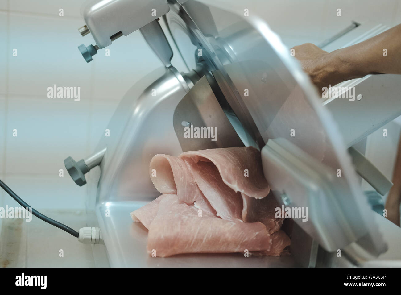 meat cutting slicing machine in food processing factory industry Stock ...