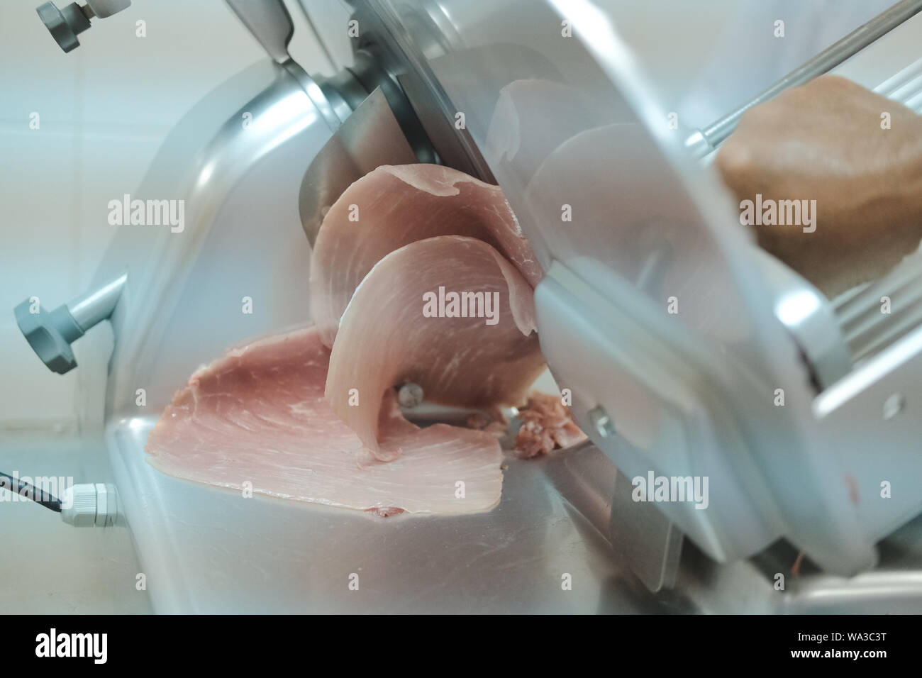 meat cutting slicing machine in food processing factory industry Stock ...