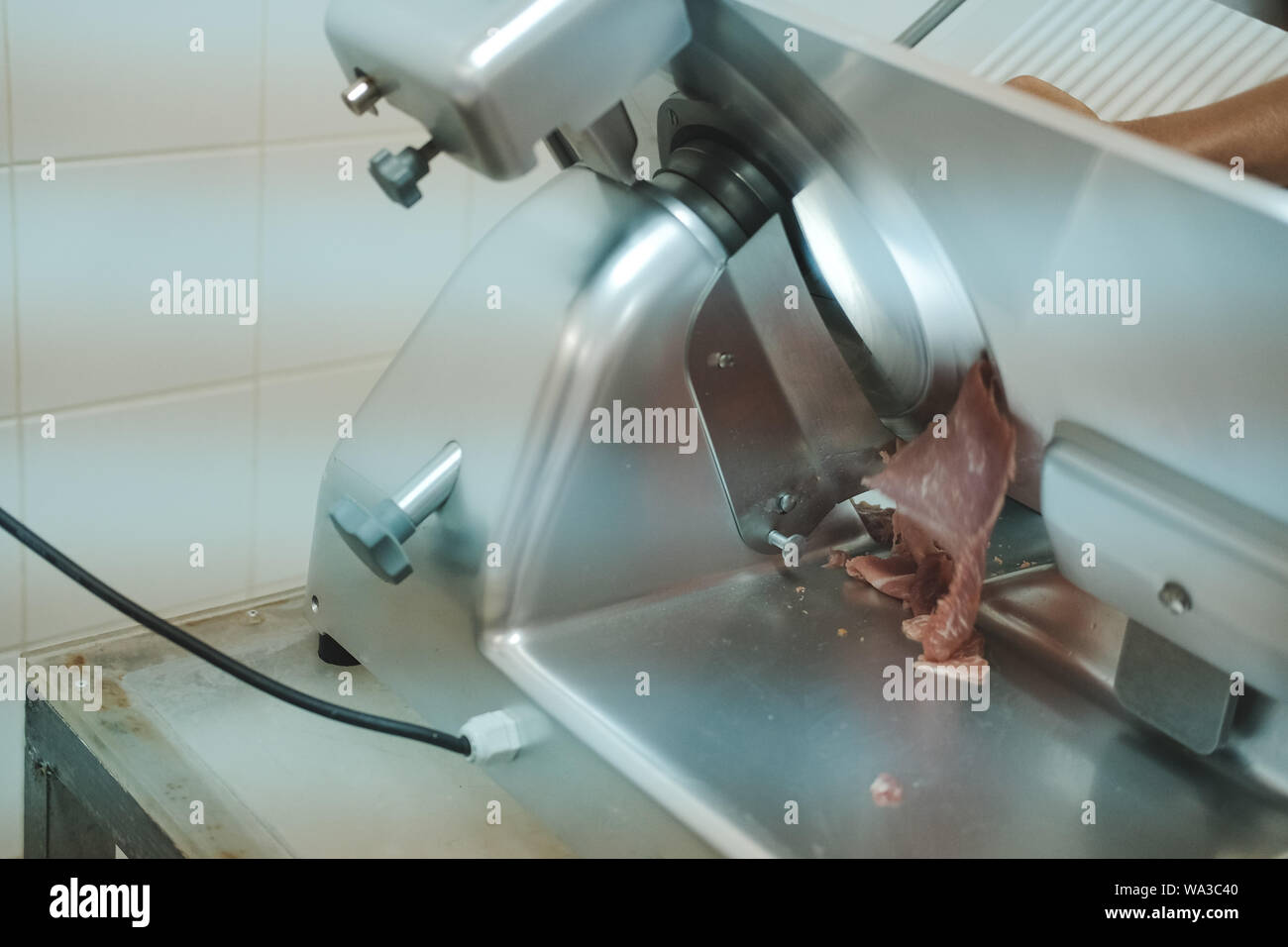 meat cutting slicing machine in food processing factory industry Stock ...