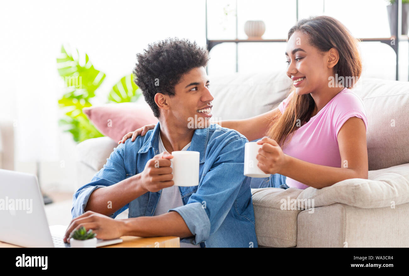 Teenagers In Love Spending Time Together, Drinking Coffee on Couch ...