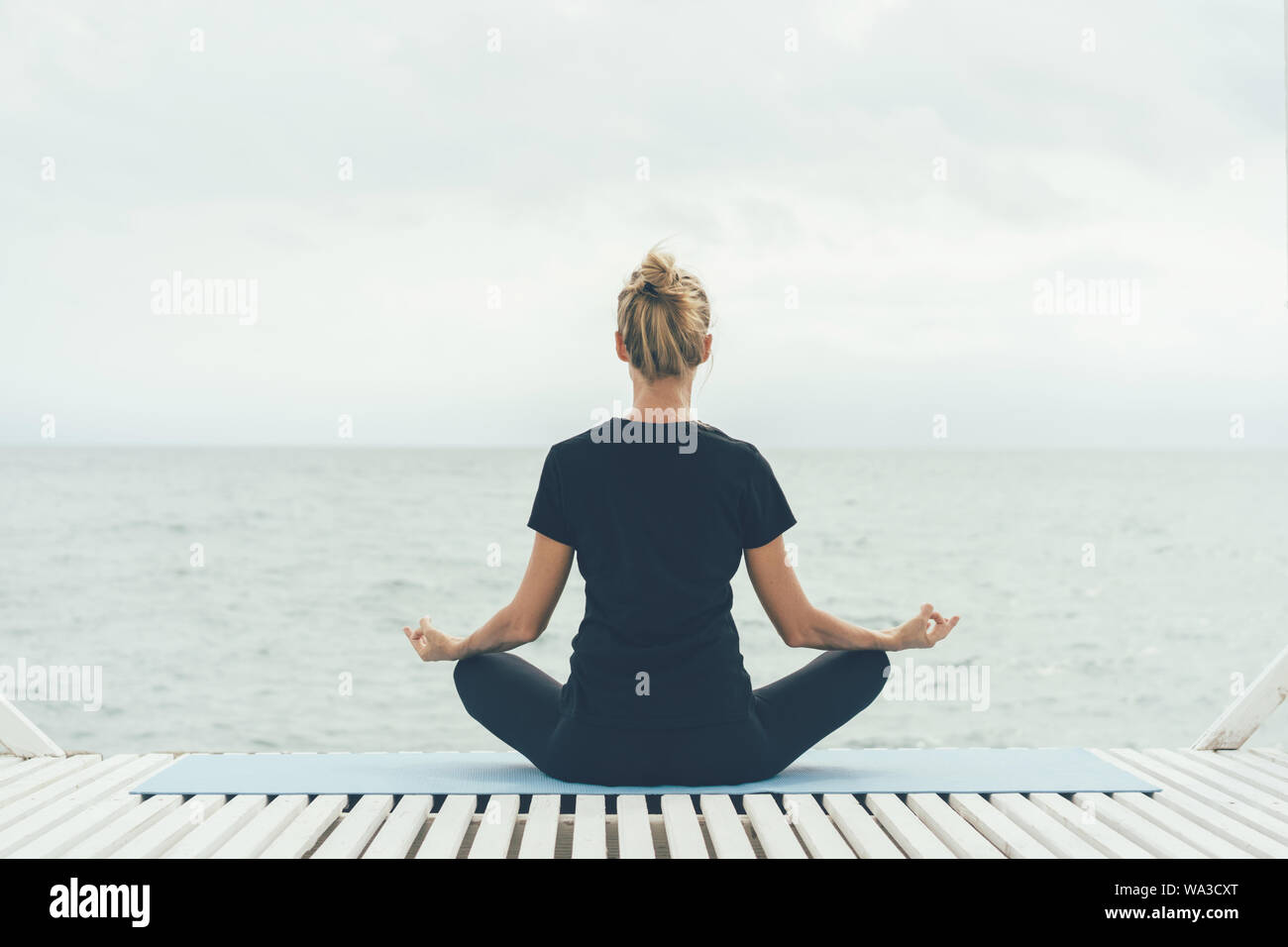 Woman lotus position hi-res stock photography and images - Alamy