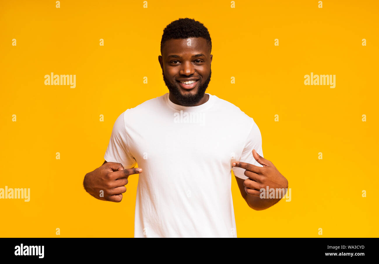 Self-assured and charismatic black man promoting himself, pointing at ...