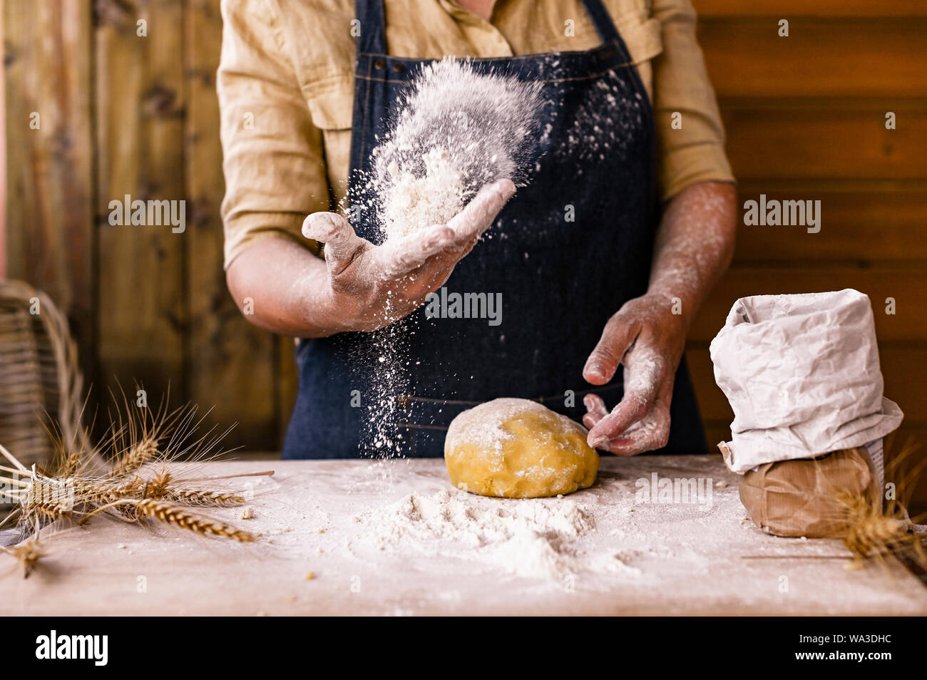 Women's hands, flour and dough. Levitation in a frame of dough and ...
