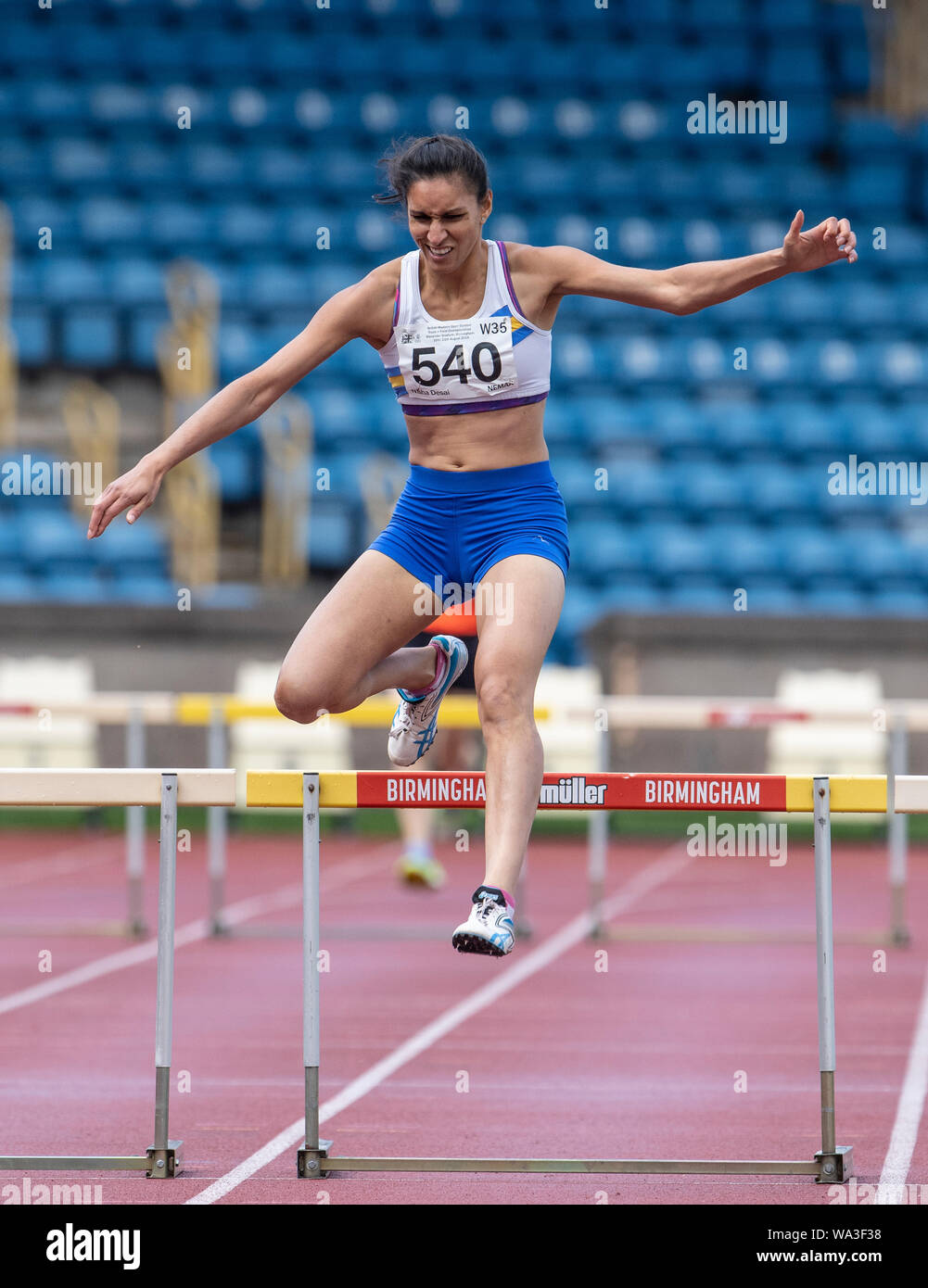 BIRMINGHAM - ENGLAND 10 AUG 2019: Nisha Desai W35 competing in the 400m ... BIRMINGHAM - ENGLAND 10 AUG 2019: Nisha Desai W35 competing in the 400m ...
