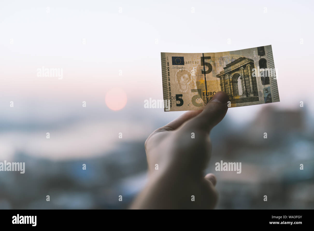 Giving hand euros hi-res stock photography and images - Alamy