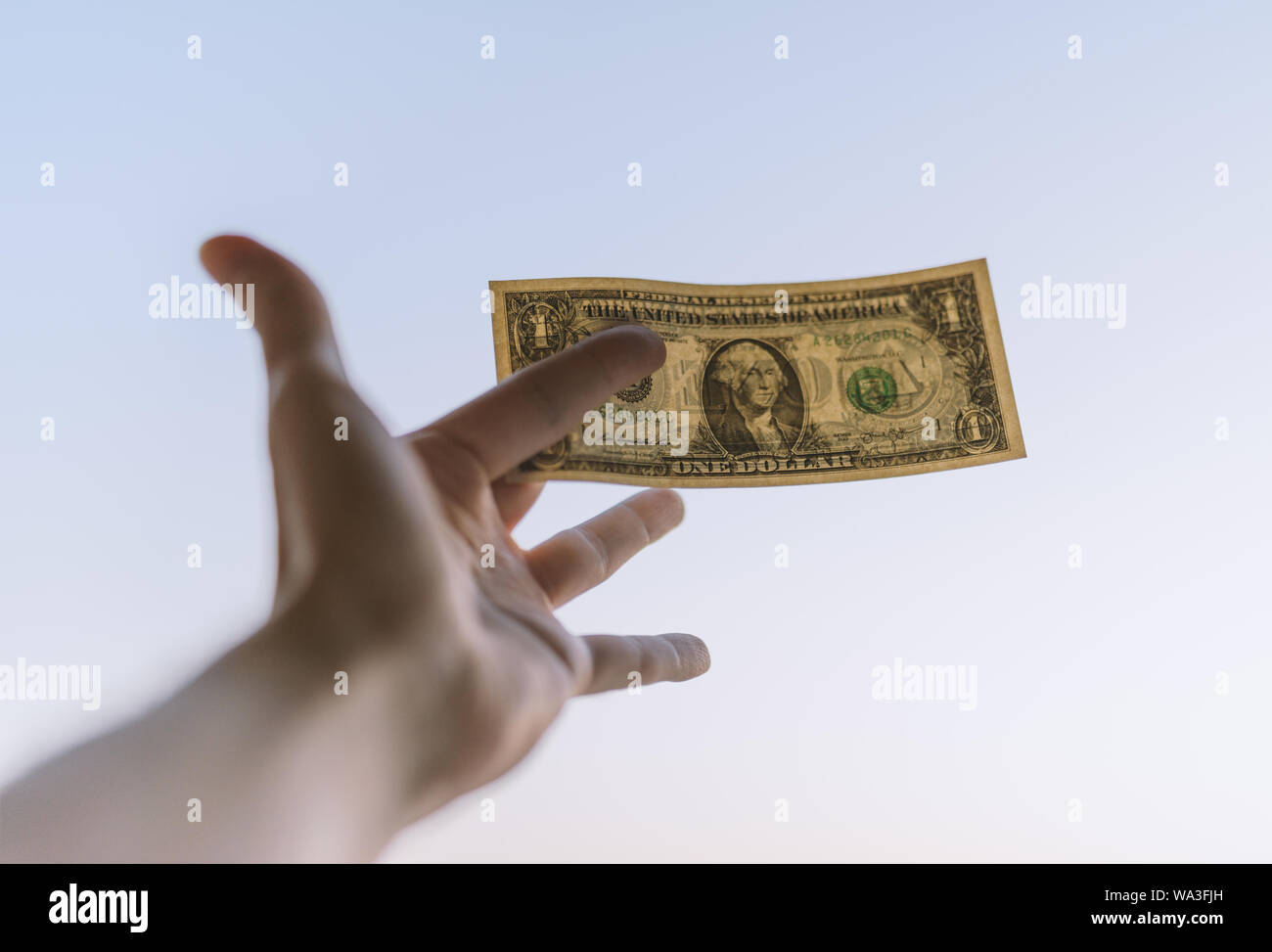 Man giving an one dollar bill hi-res stock photography and images - Alamy