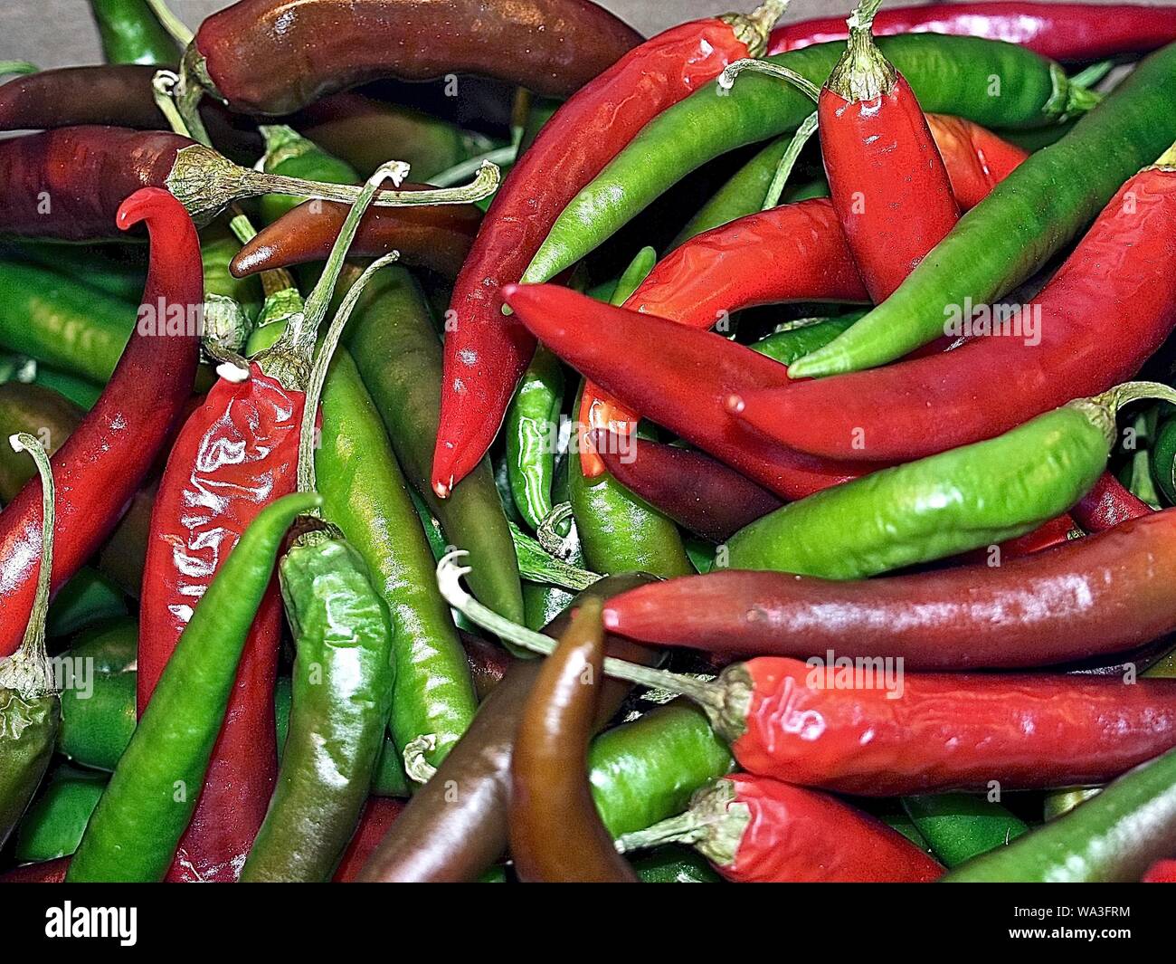 Mix of red an green pepperoni peppers Stock Photo - Alamy