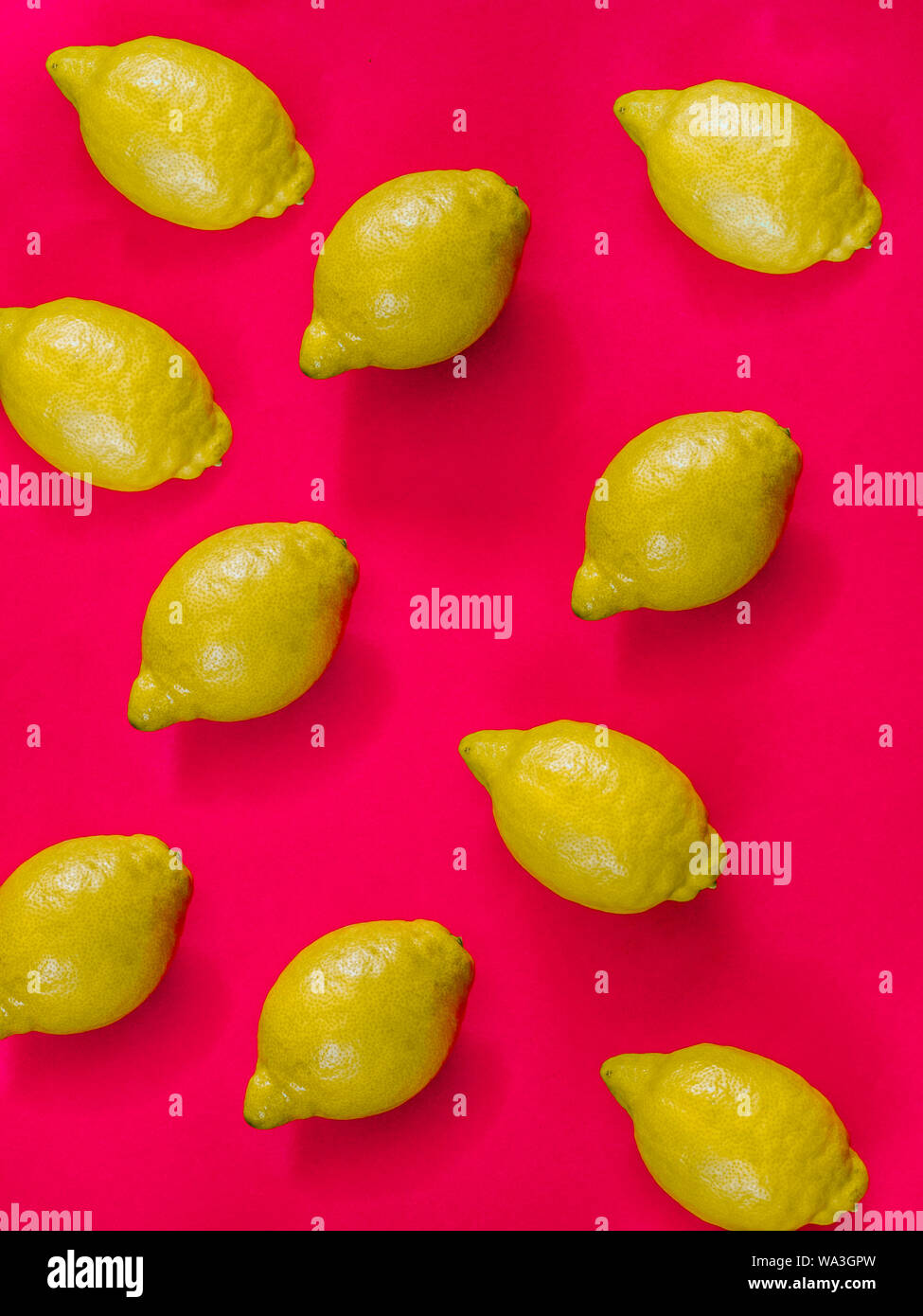 Lemon pattern on strong red background Stock Photo - Alamy