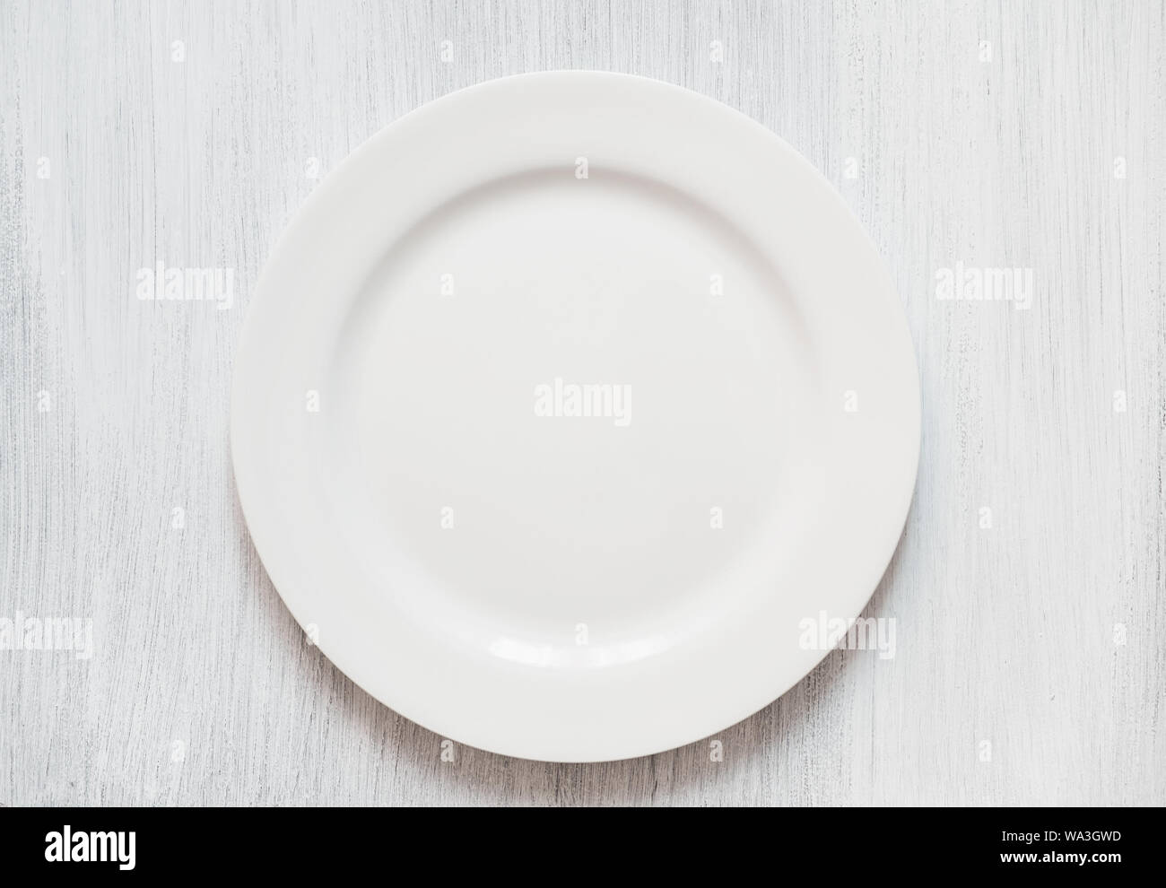 White round plate on white background. Empty white plate on white ...