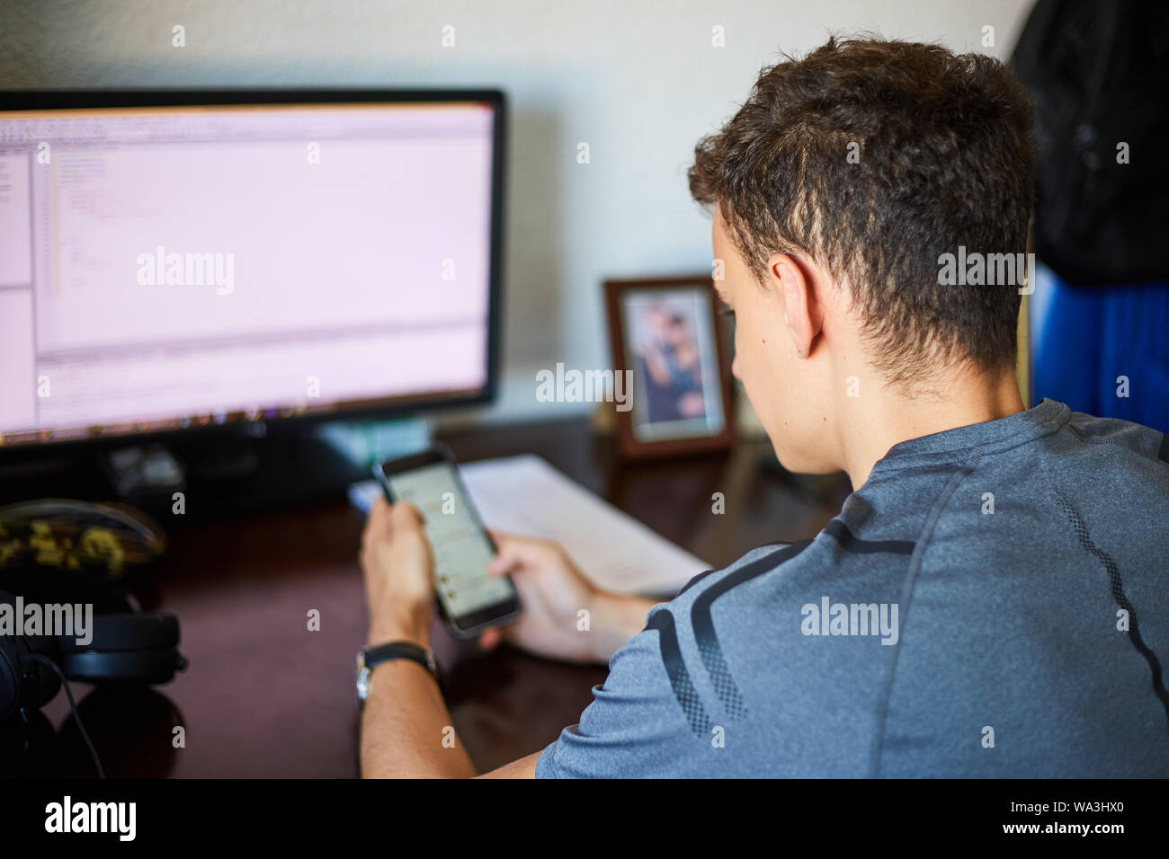 Student at his desk doing homework Stock Photo - Alamy